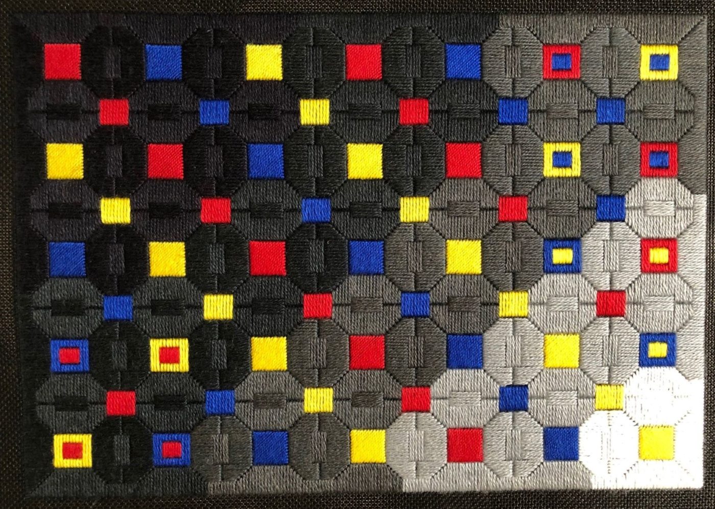 Embroidered art around the site | EGA