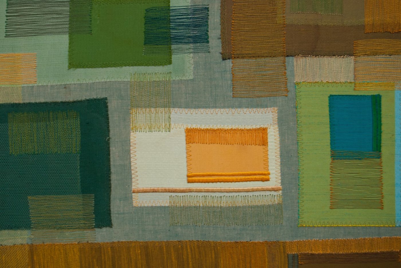 Embroidered art around the site | EGA